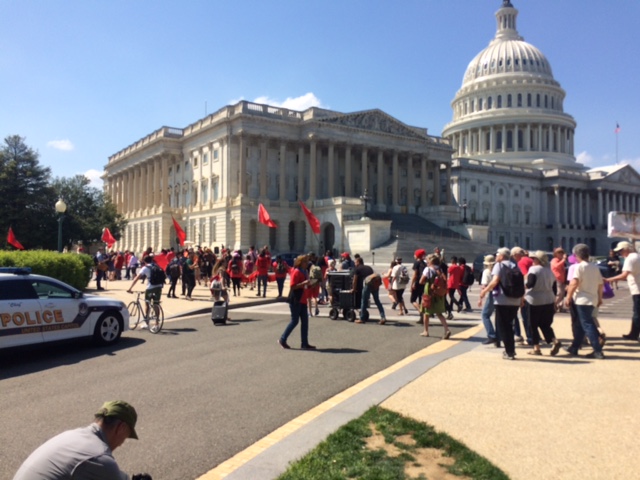 Environmental Protest Forms a Red Line On the Capitol East Lawn ...